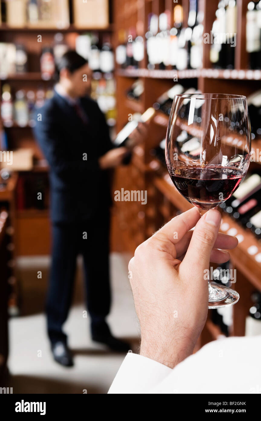 Man holding a wine glass Stock Photo - Alamy