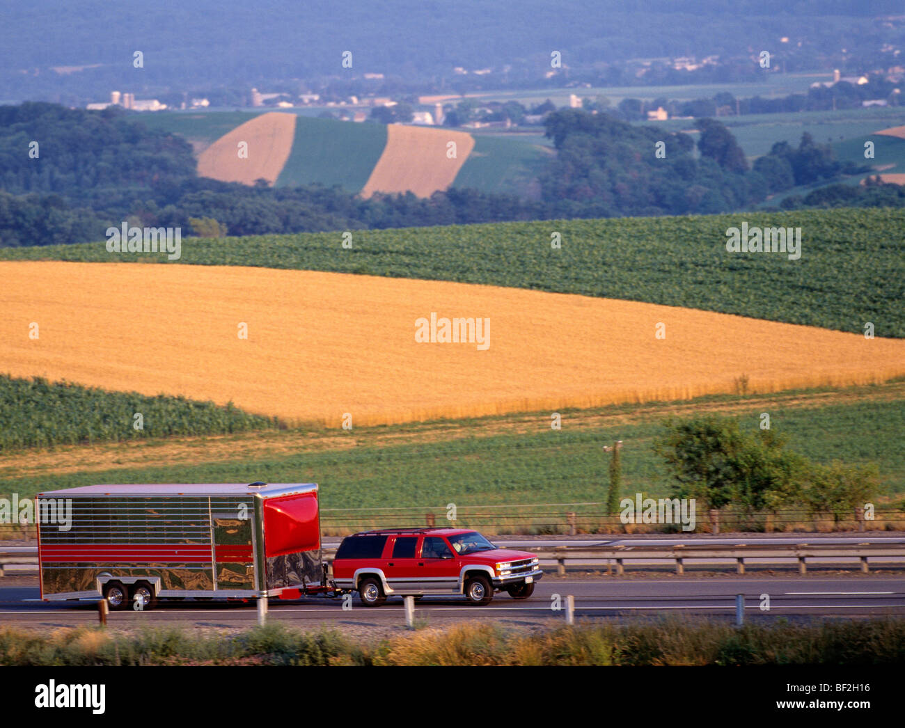 Chevy Suburban towing a trailer in Colorado on the Interstate Highway ...
