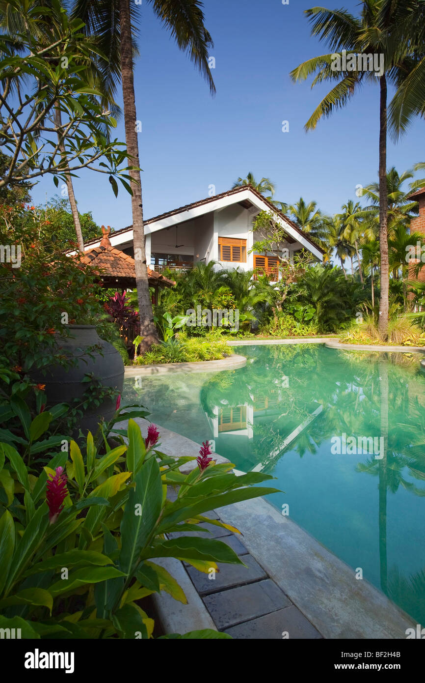 A luxury tropical modern villa with swimming pool surrounded by ...