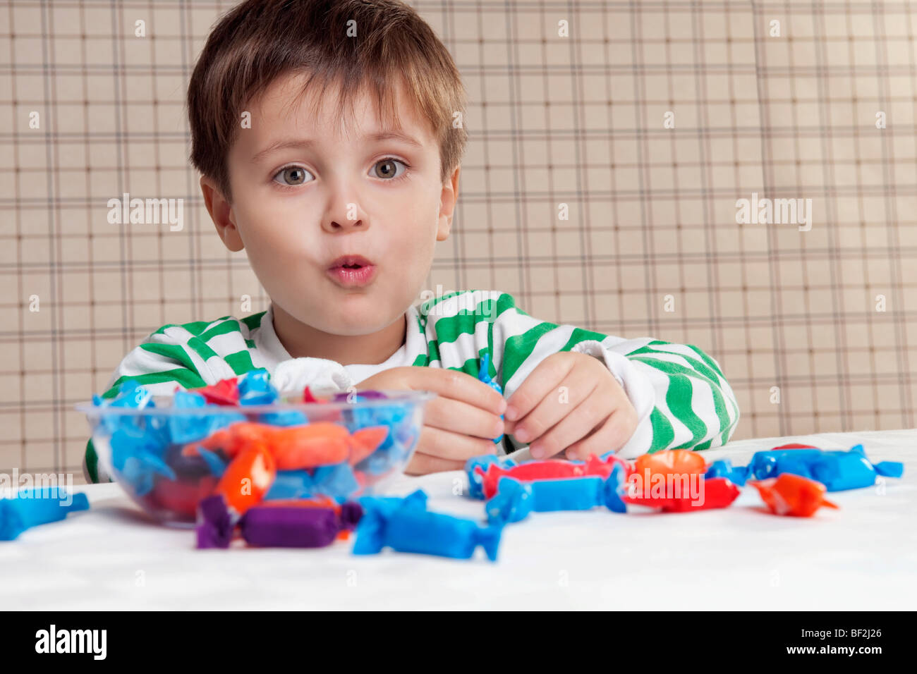 Close-up of a boy eating a candy Stock Photo - Alamy