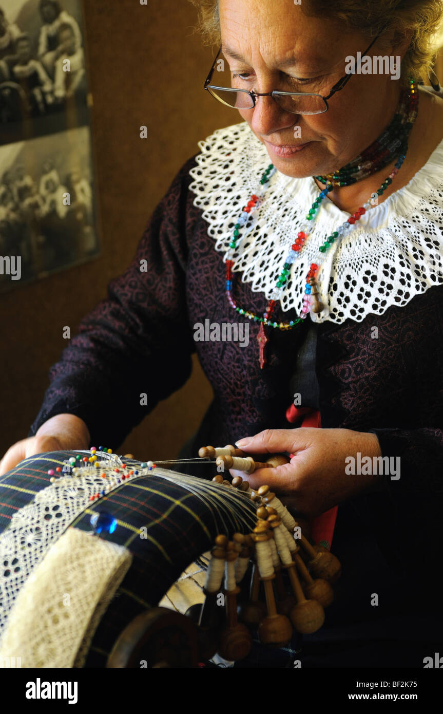 A lace maker wearing traditional dress in Cogne, Aosta valley, Italy ...