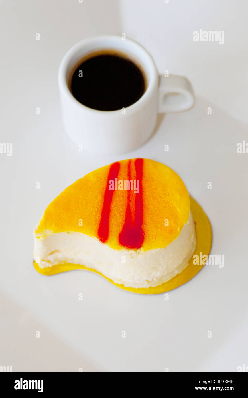 High angle view of a mousse pastry with a cup of black coffee Stock ...