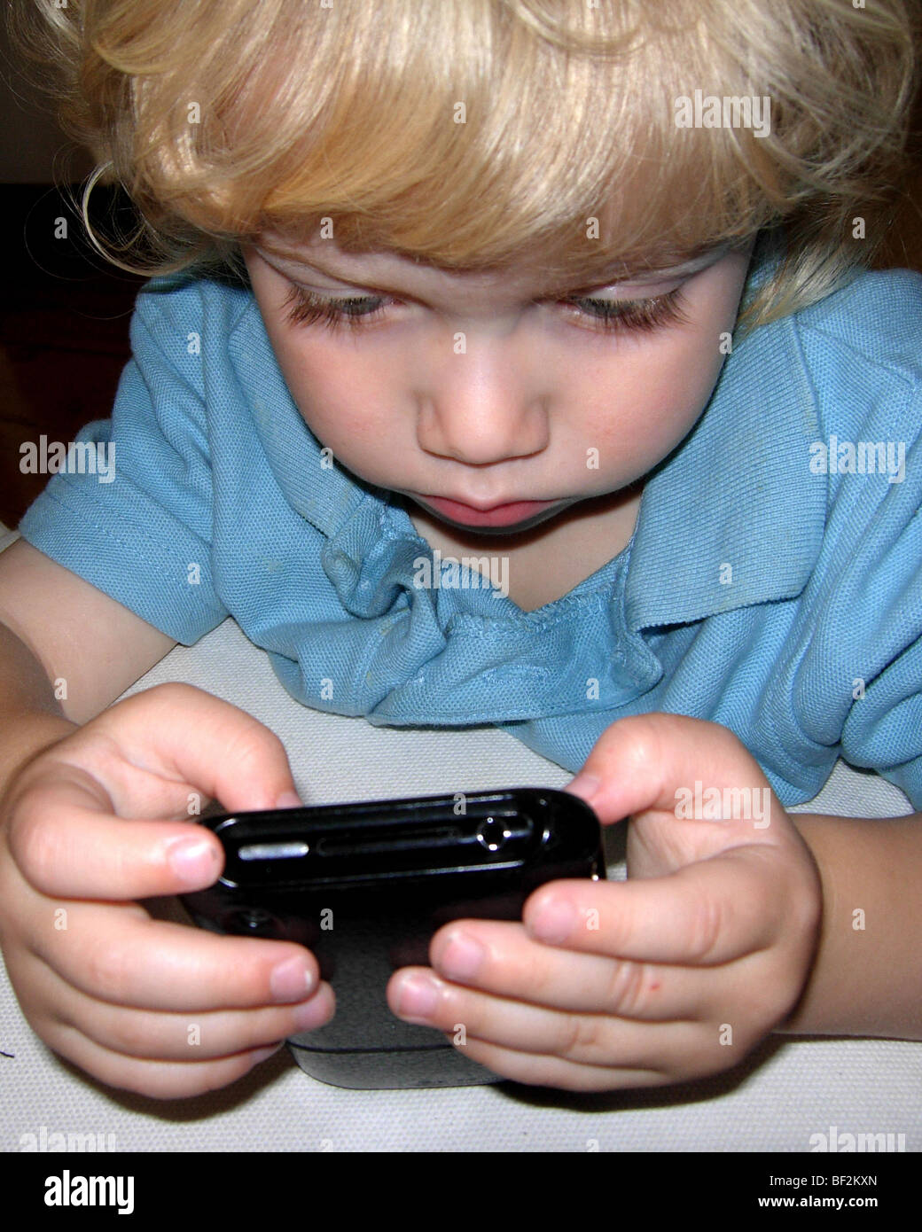 Toddler using an iPhone Stock Photo - Alamy