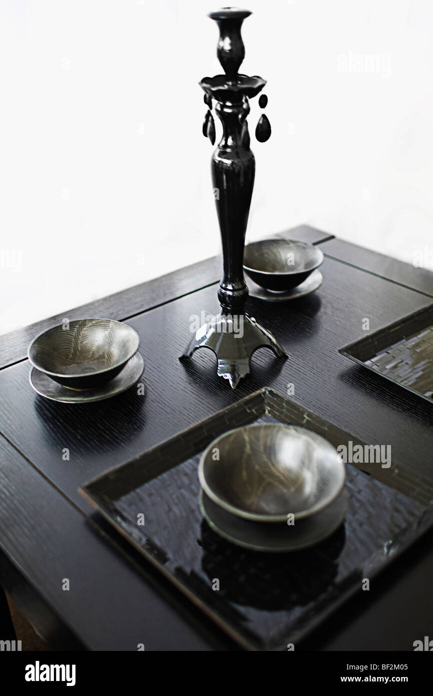 Bowls and a showpiece on a table Stock Photo - Alamy