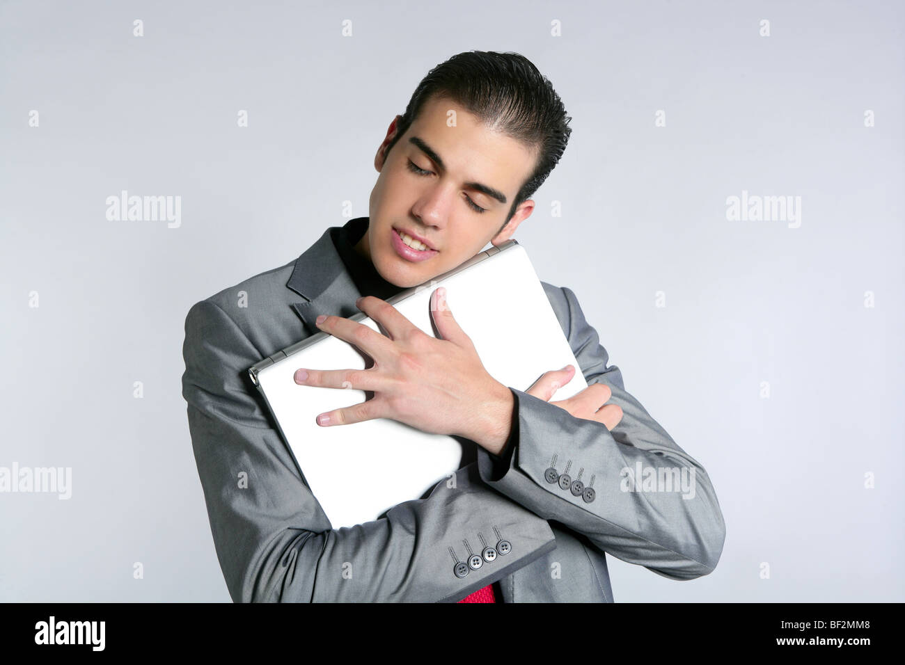 Businessman young embracing computer, hug laptop love his work Stock ...