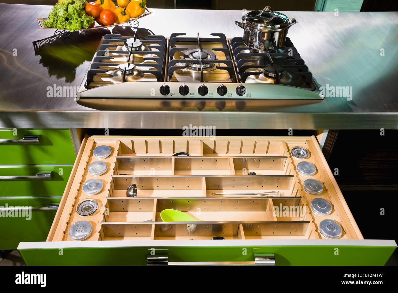 Stove with an open drawer in the kitchen Stock Photo - Alamy
