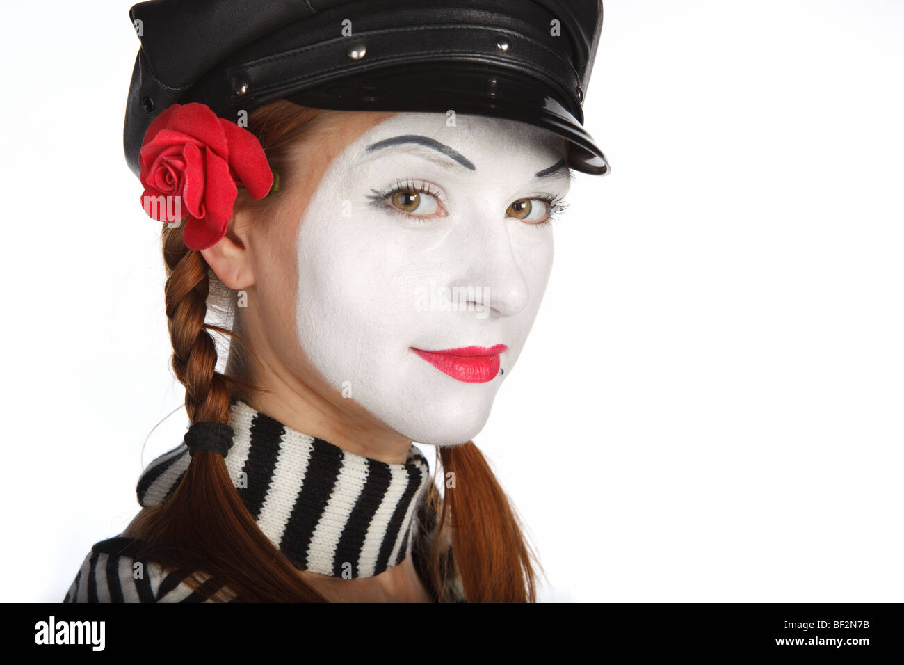 Portrait of a young lady dressed up as a mime, isolated over white ...