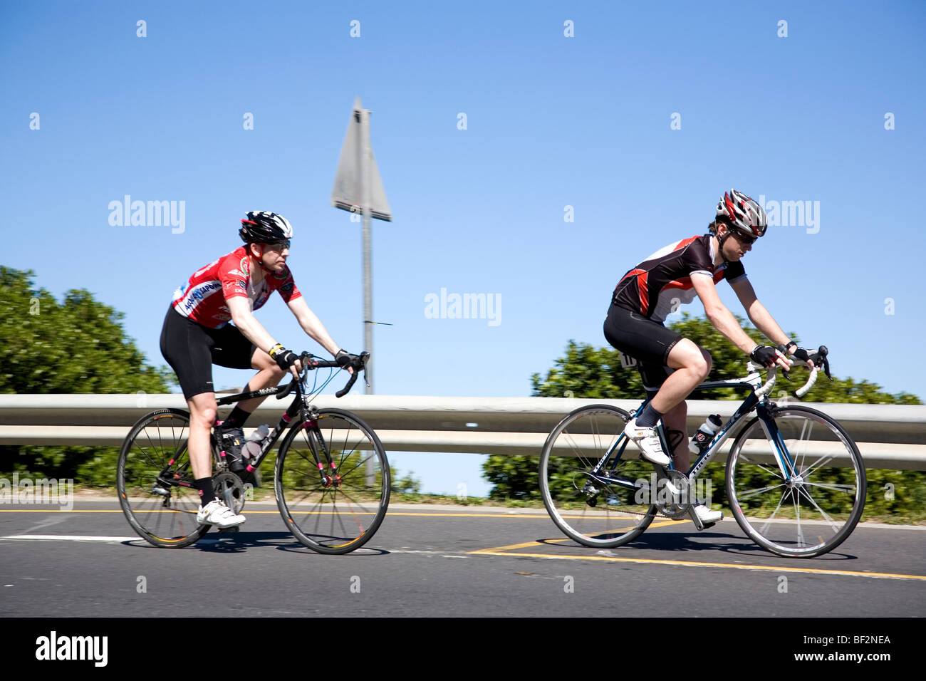 Man biking on uphill road hi-res stock photography and images - Alamy