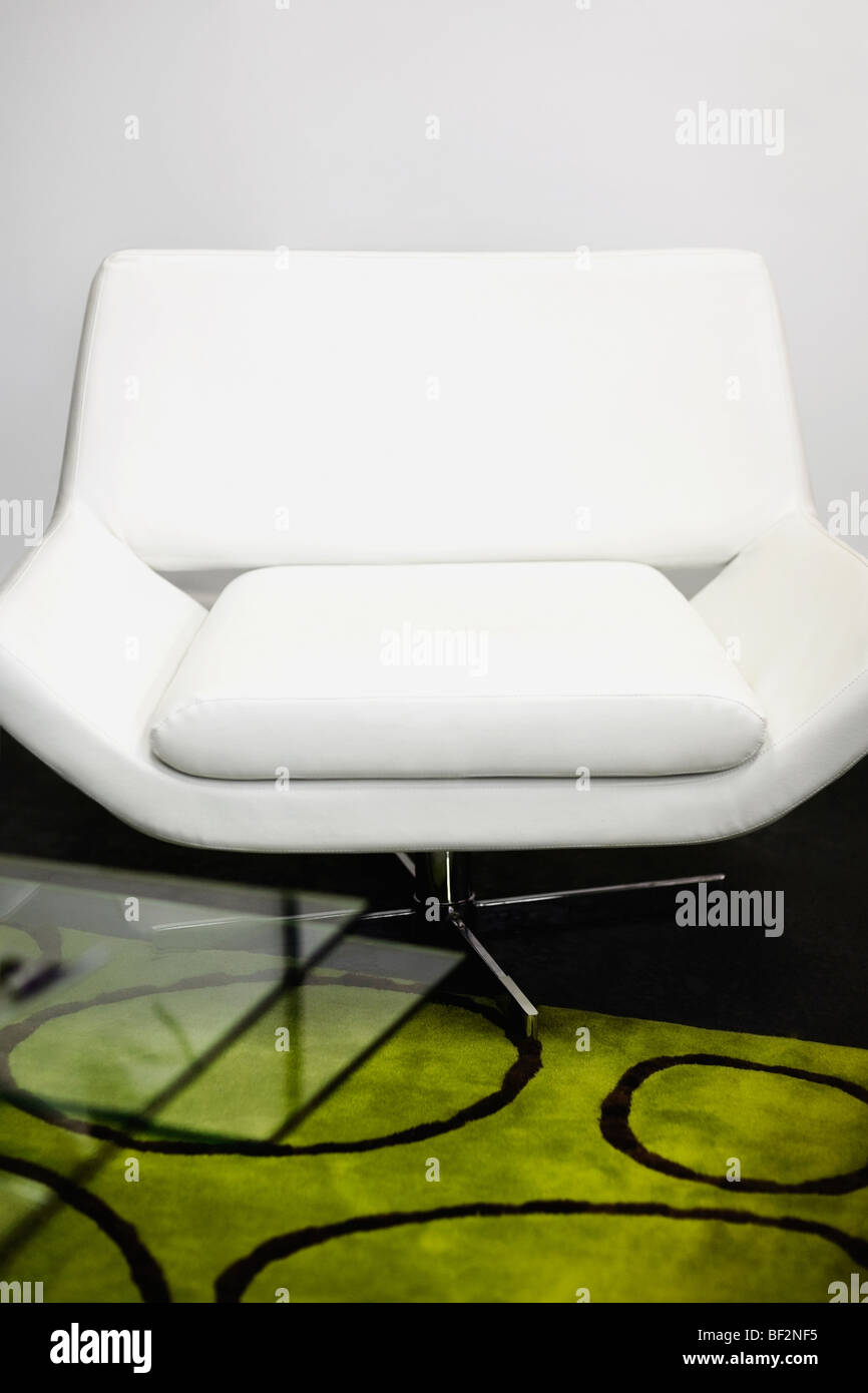 Chair with a table in a living room Stock Photo - Alamy