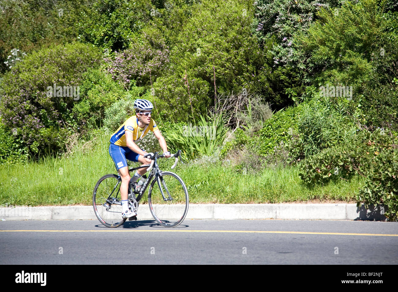 Lone cyclist road hi-res stock photography and images - Alamy