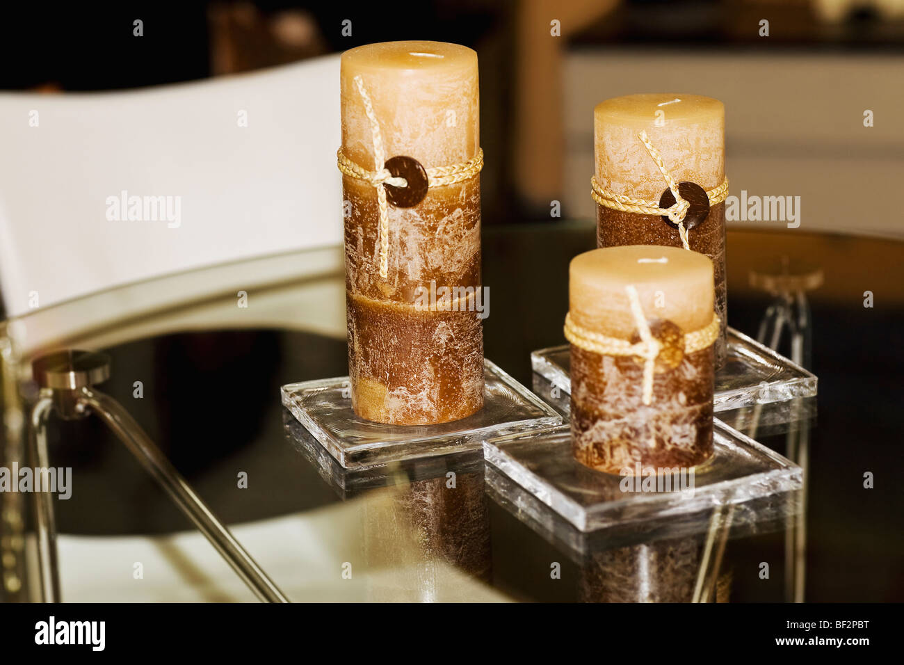 Close-up of candles on a dining table Stock Photo - Alamy