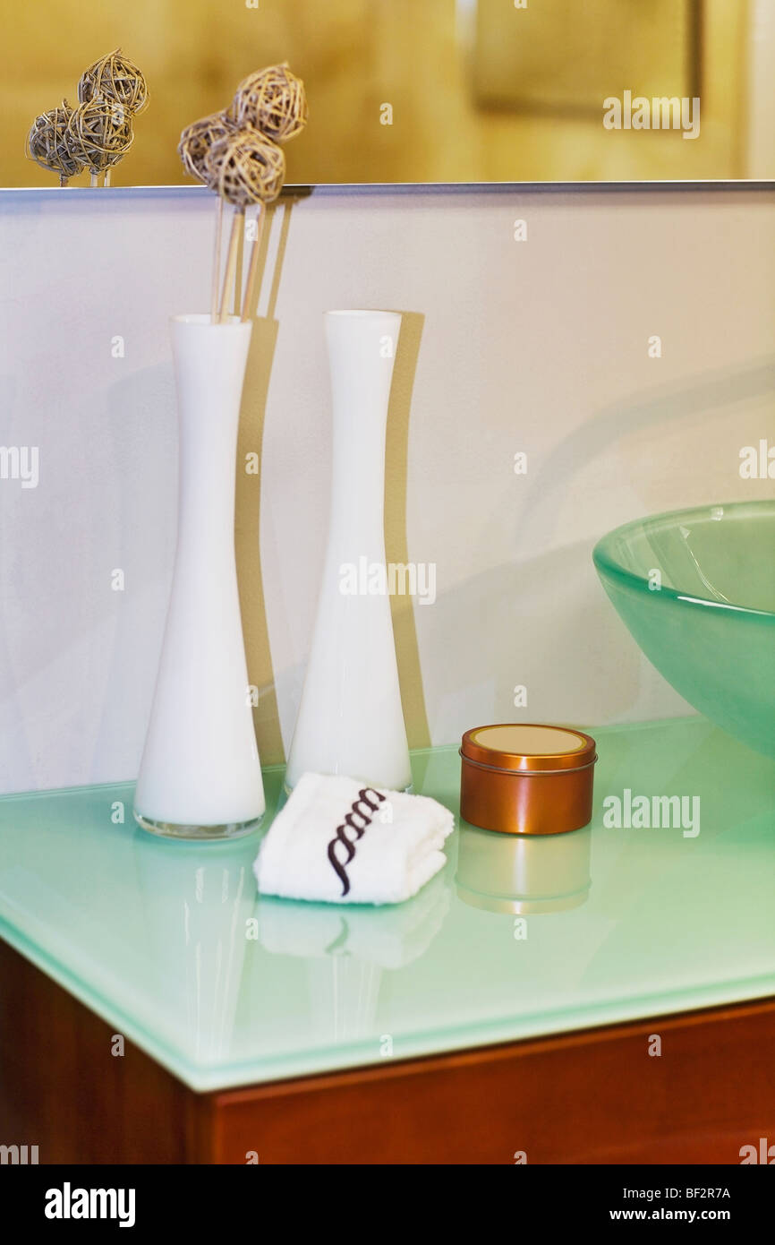 Vases near a wash bowl in the bathroom Stock Photo - Alamy