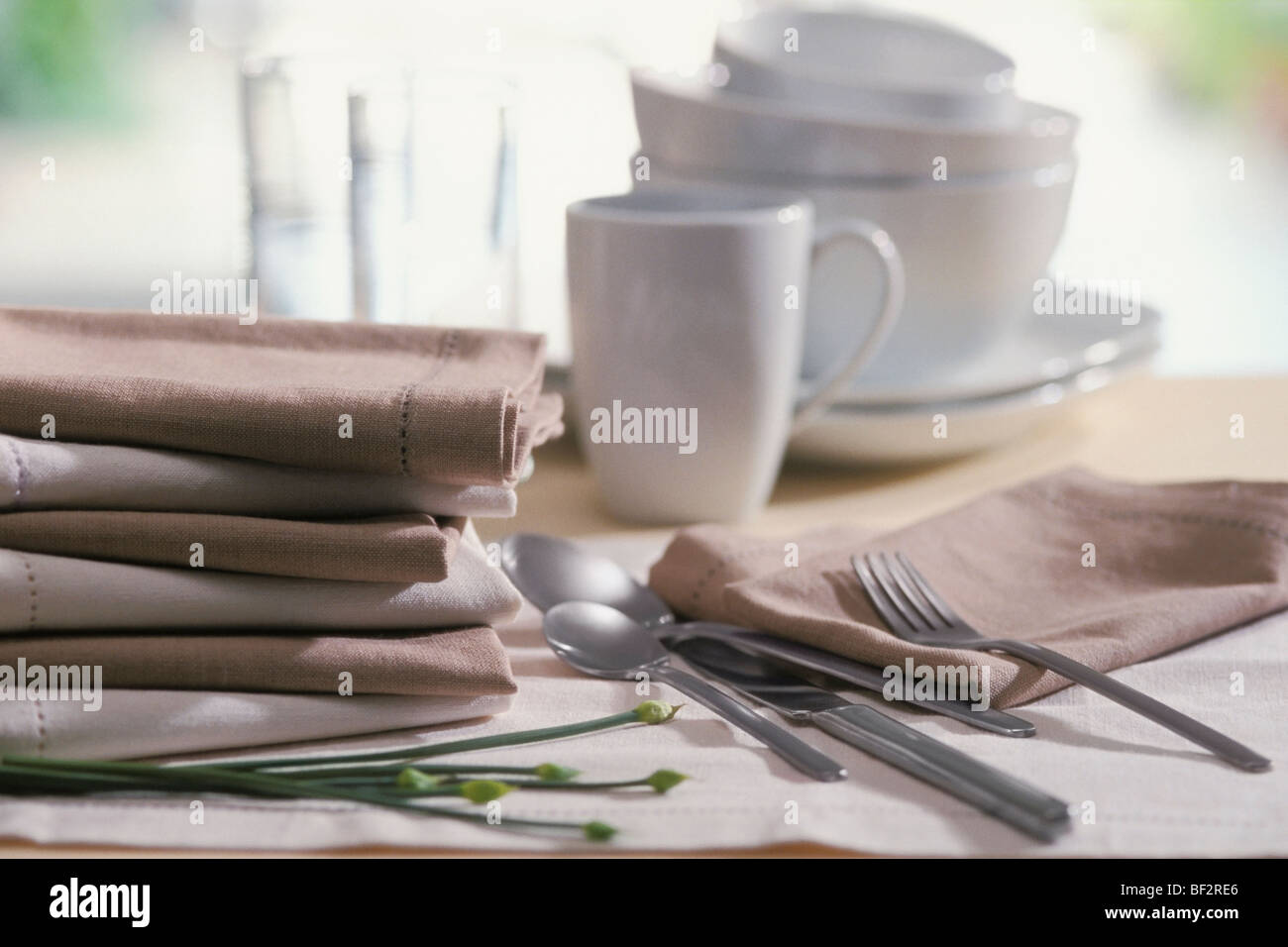 Close-up of cutlery and linen on a table Stock Photo - Alamy