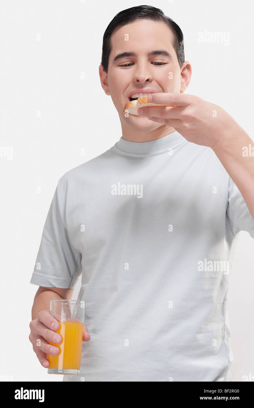 Man eating a toast Stock Photo - Alamy