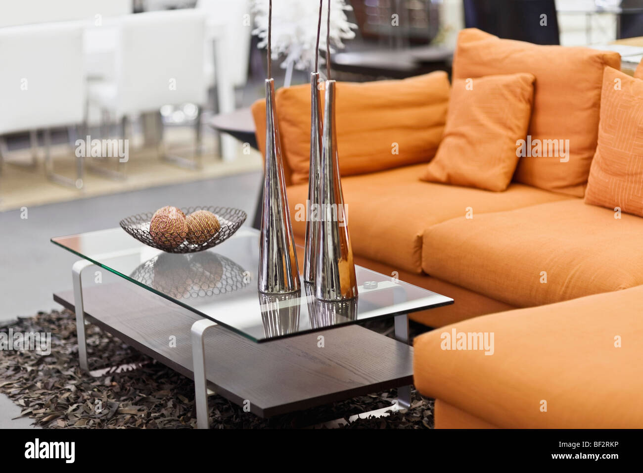 Showpieces on a table with a couch Stock Photo - Alamy