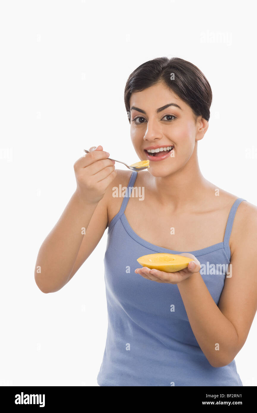 Eating mango hi-res stock photography and images - Alamy