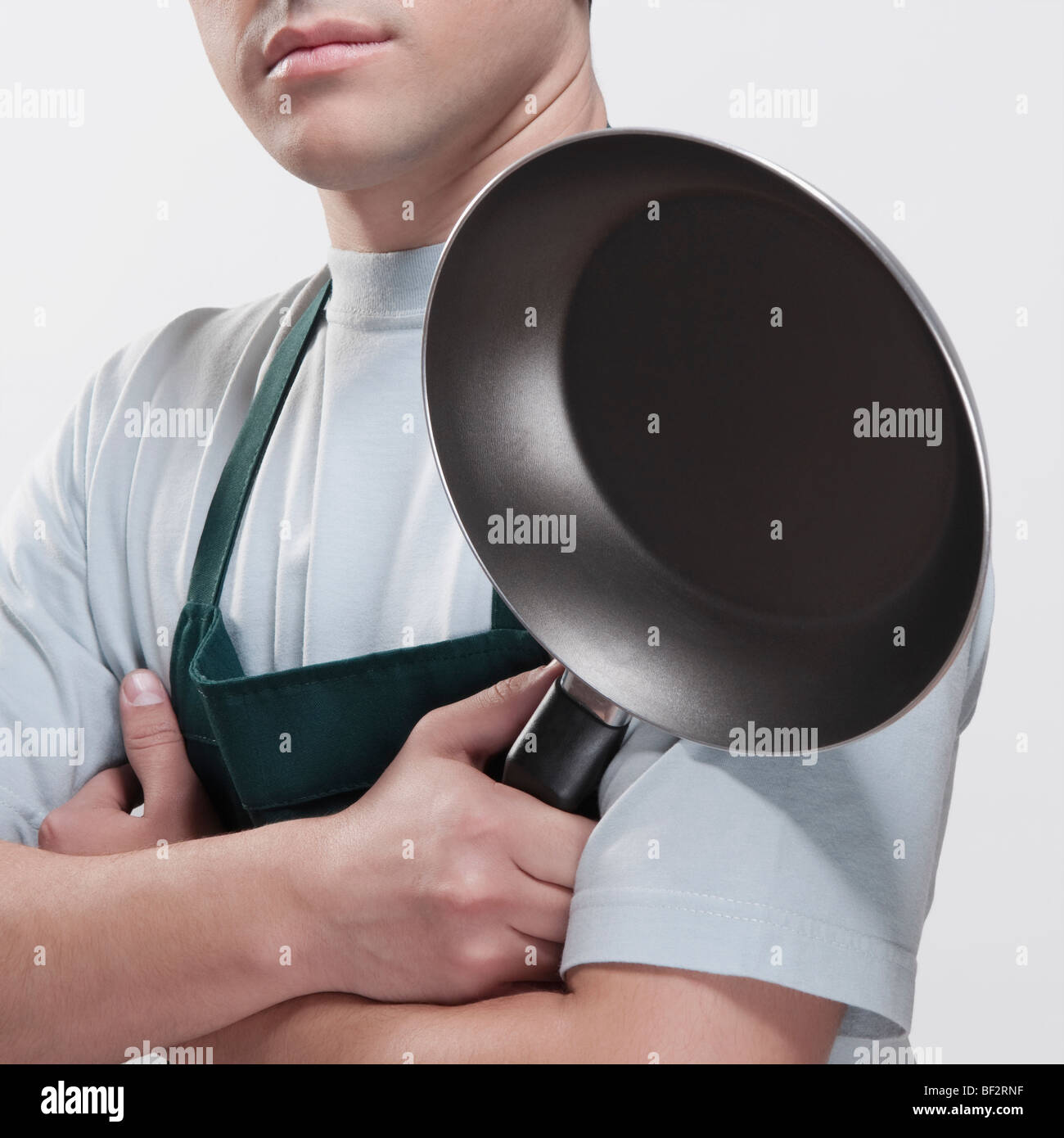 Man holding a frying pan Stock Photo - Alamy