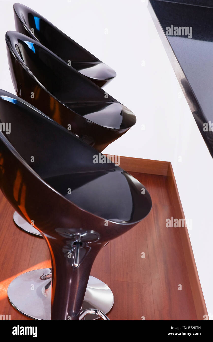 Three chairs in a row Stock Photo - Alamy