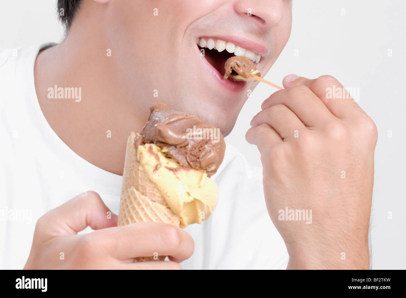 Man eating an ice cream Stock Photo - Alamy