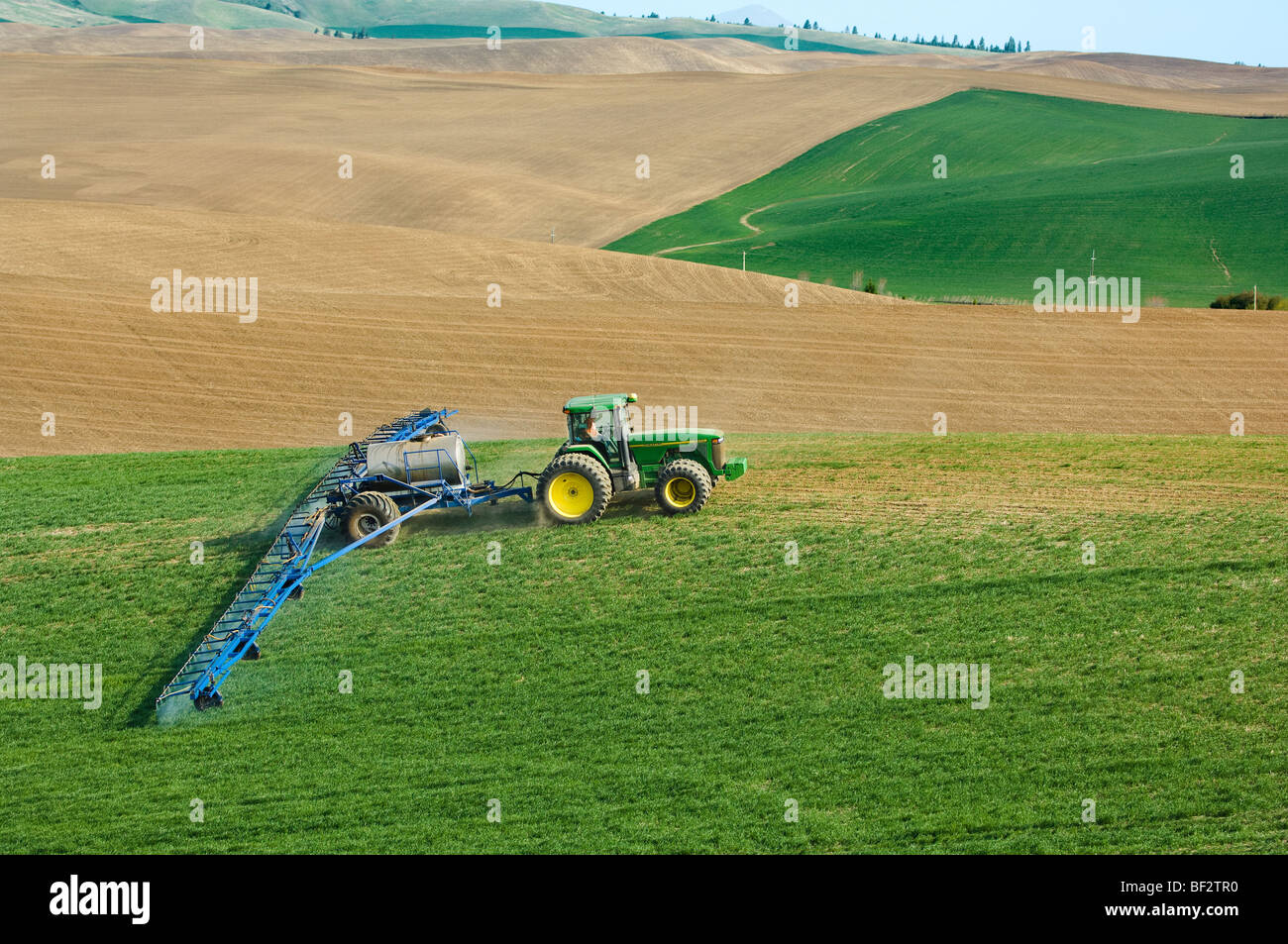 Ground application of herbicide for weed control on a field of early ...