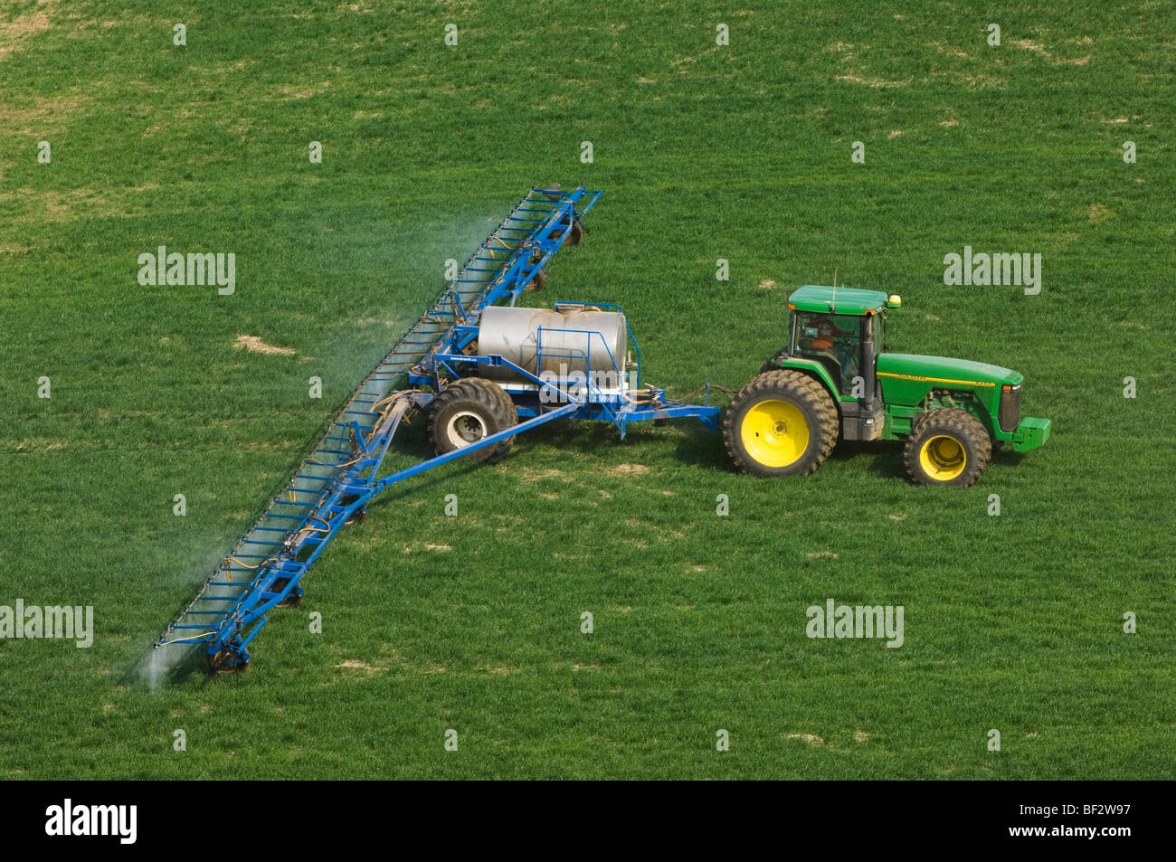 Ground application of herbicide for weed control on a field of early ...