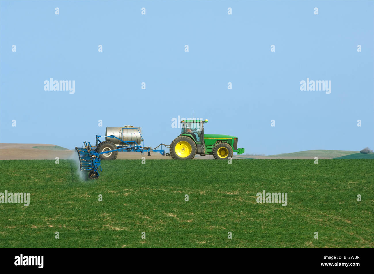 Ground application of herbicide for weed control on a field of early ...