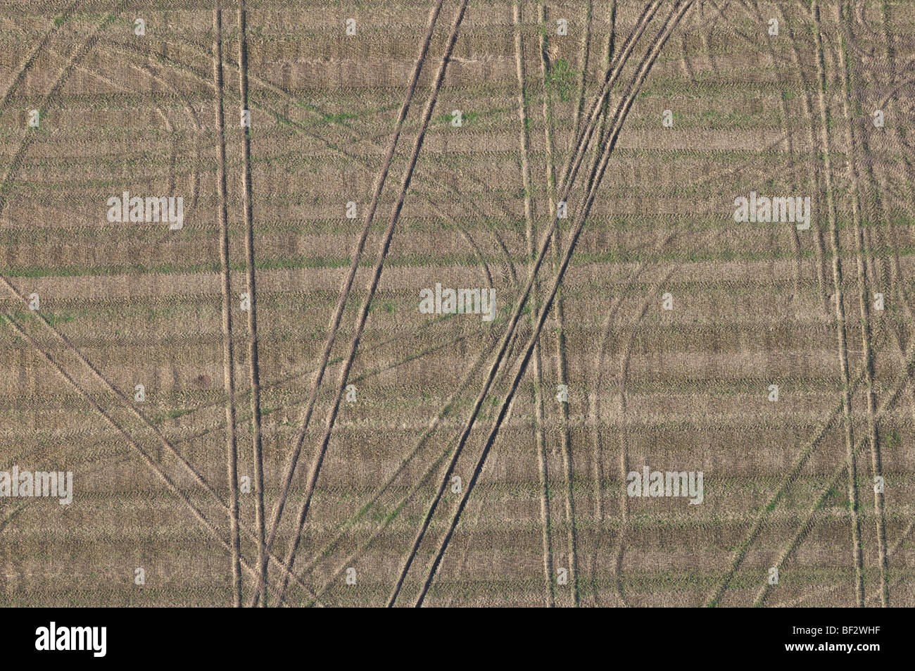 Plough and tractor marks in a field Stock Photo - Alamy