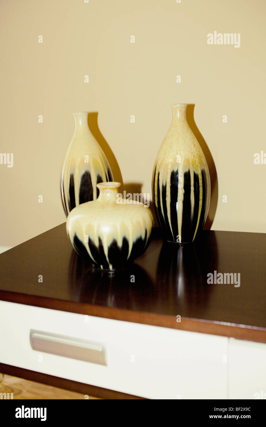 Three vases on a sideboard Stock Photo - Alamy