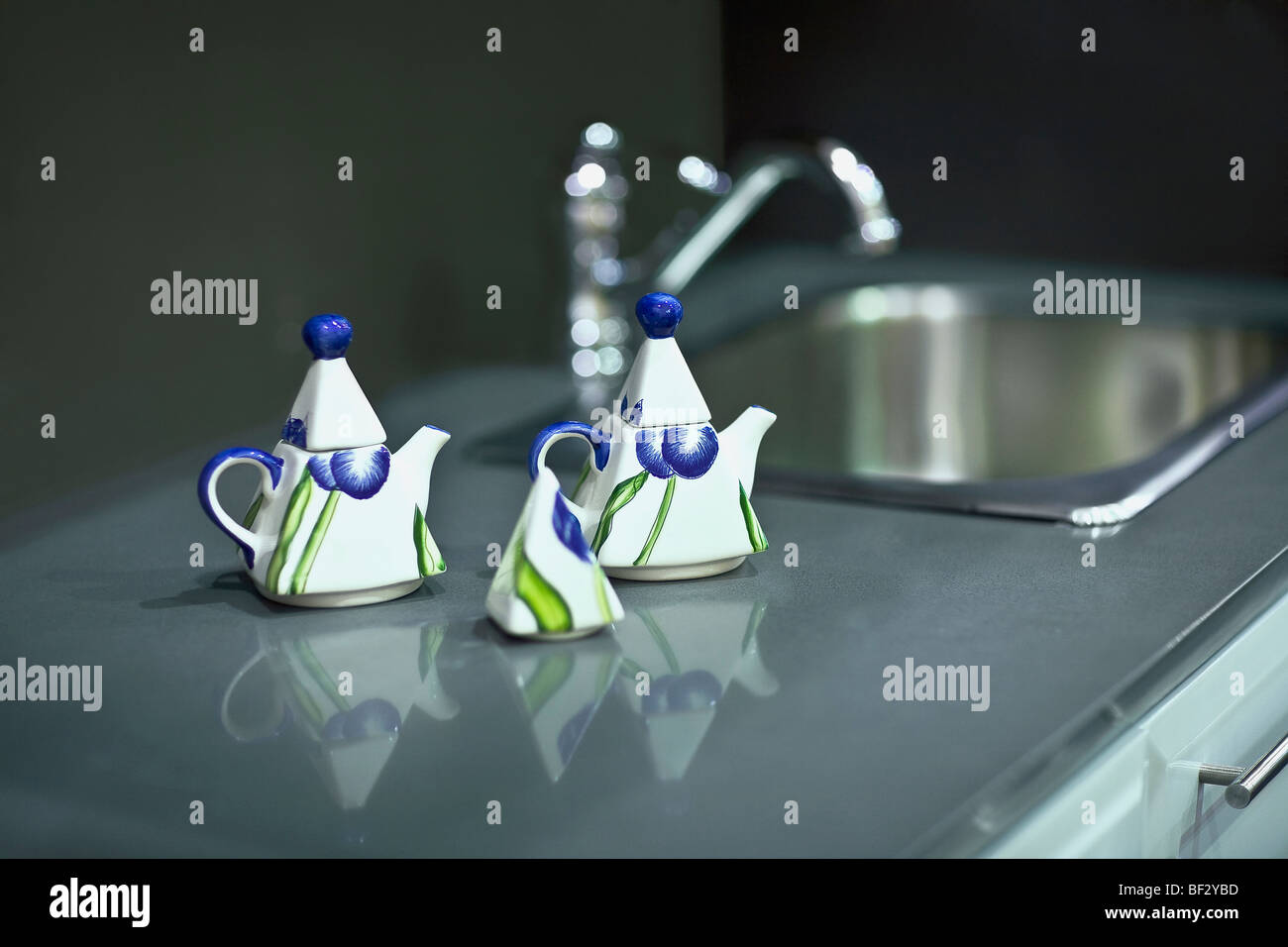 Kettles on a kitchen counter Stock Photo - Alamy