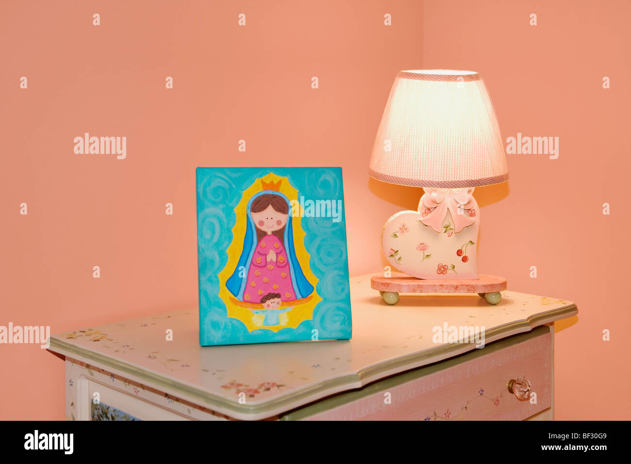 Lamp with a picture frame on a sideboard Stock Photo - Alamy