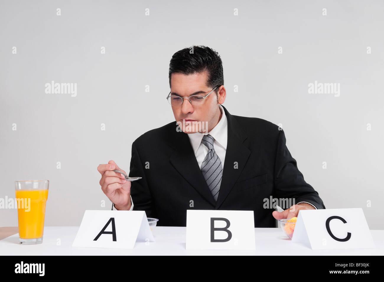 Man tasting different food samples Stock Photo - Alamy