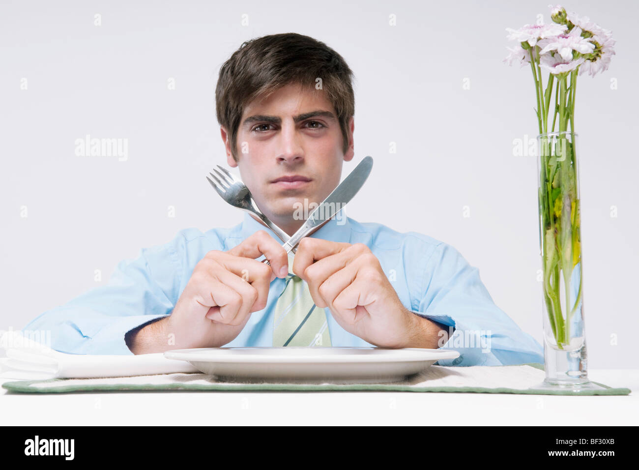 Portrait of a businessman waiting for dinner Stock Photo - Alamy