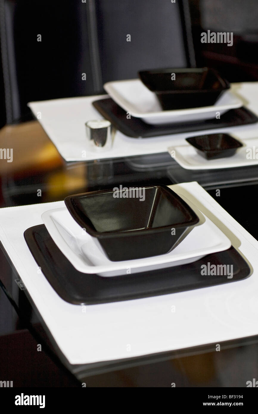 Bowl and a tray on a dining table Stock Photo - Alamy