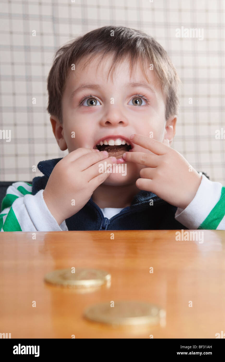 Close-up of a boy eating cookies Stock Photo - Alamy
