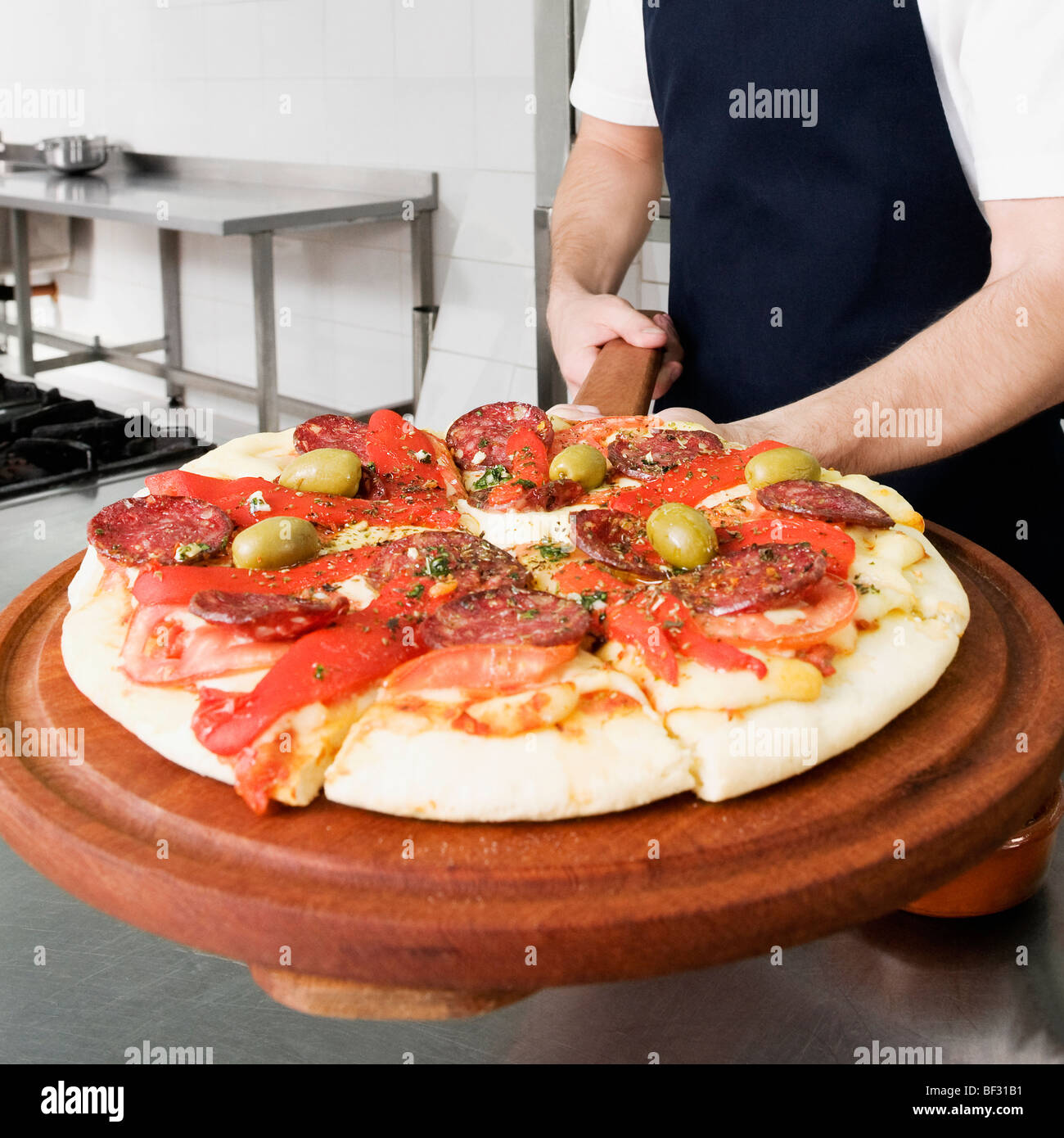 Chef preparing pizza in the kitchen Stock Photo - Alamy