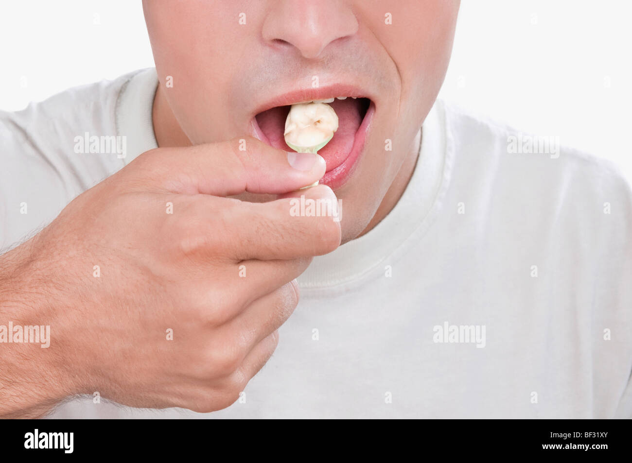 Close-up of a man eating an ice cream Stock Photo - Alamy