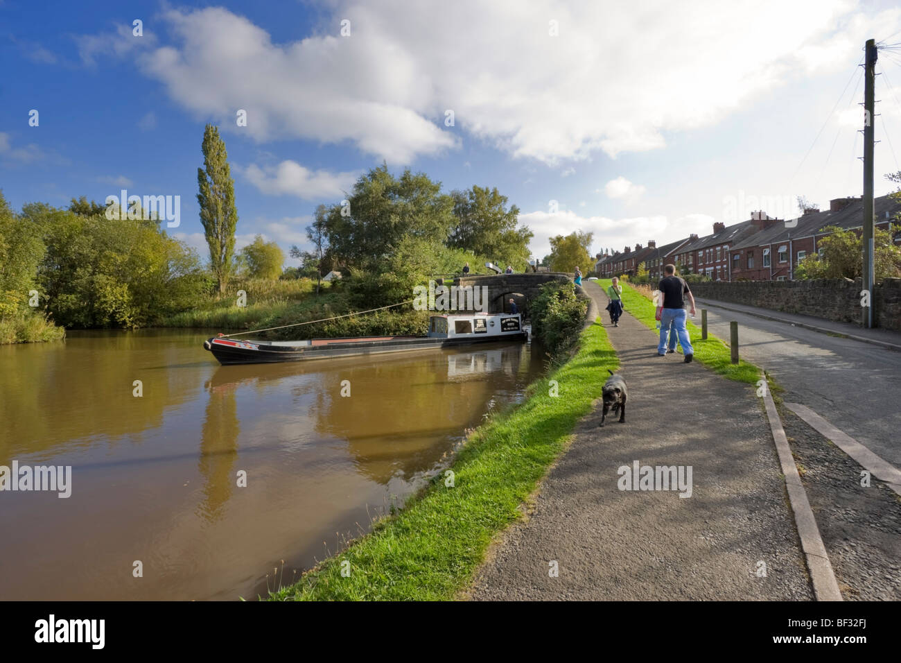 Canal boating in lock 14 of the Marple Lock Flight. A student receives ...