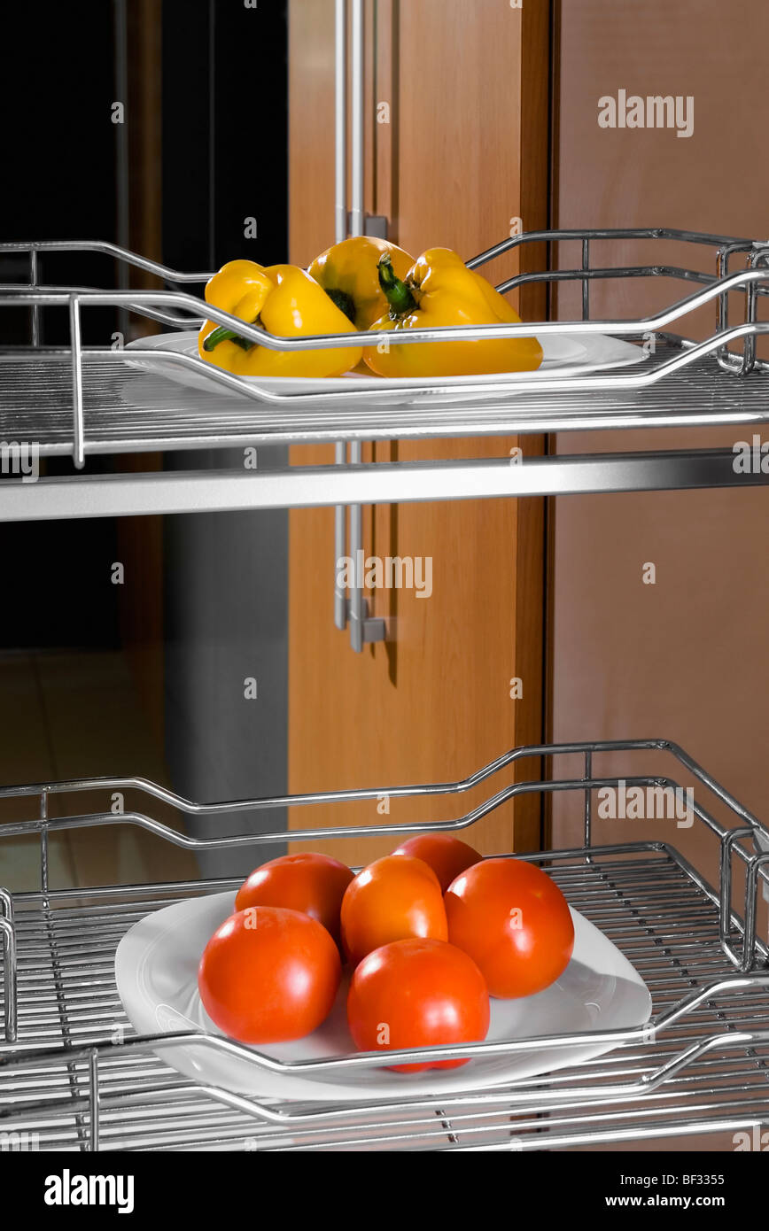 Vegetables on shelves in the kitchen Stock Photo - Alamy