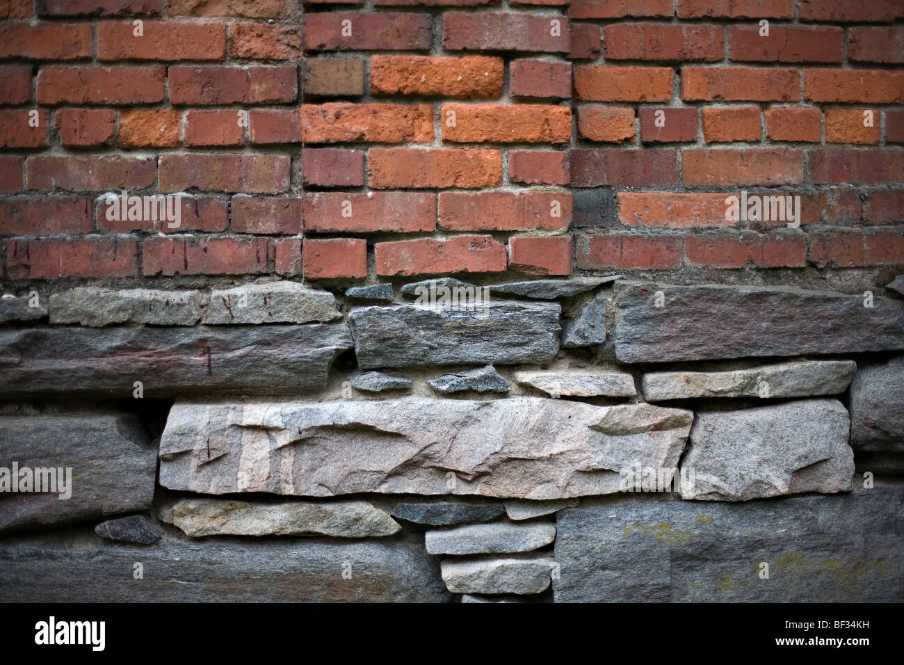 Red brick and stone make up the wall of a building Stock Photo - Alamy
