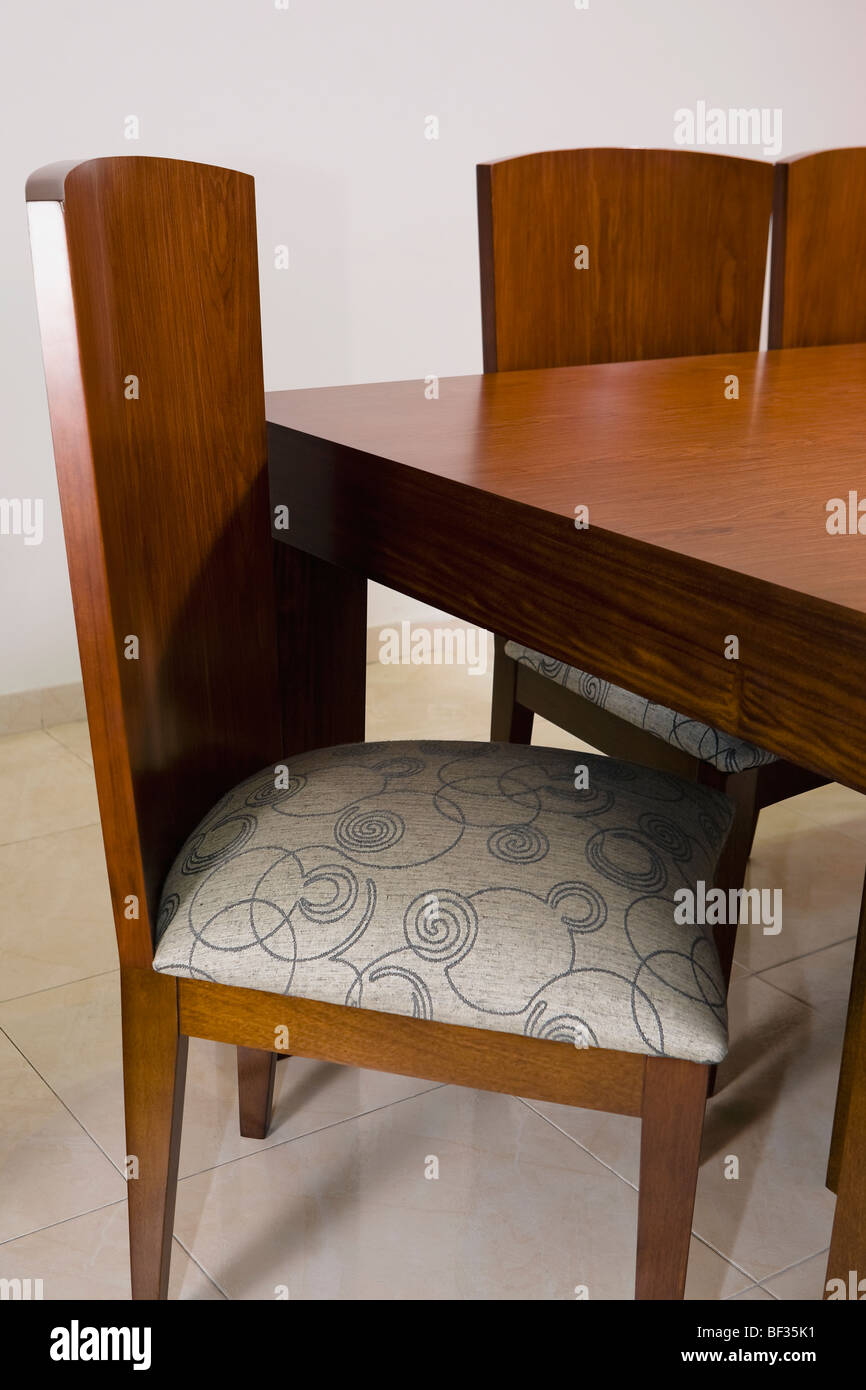 Table with chairs in a dining room Stock Photo - Alamy