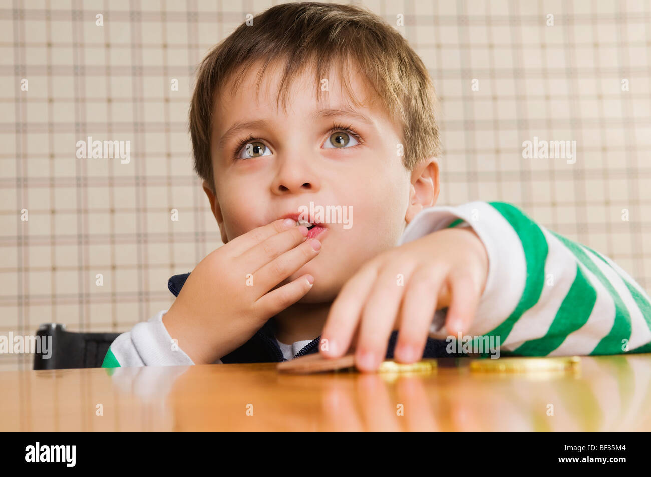 Close-up of a boy eating cookies Stock Photo - Alamy