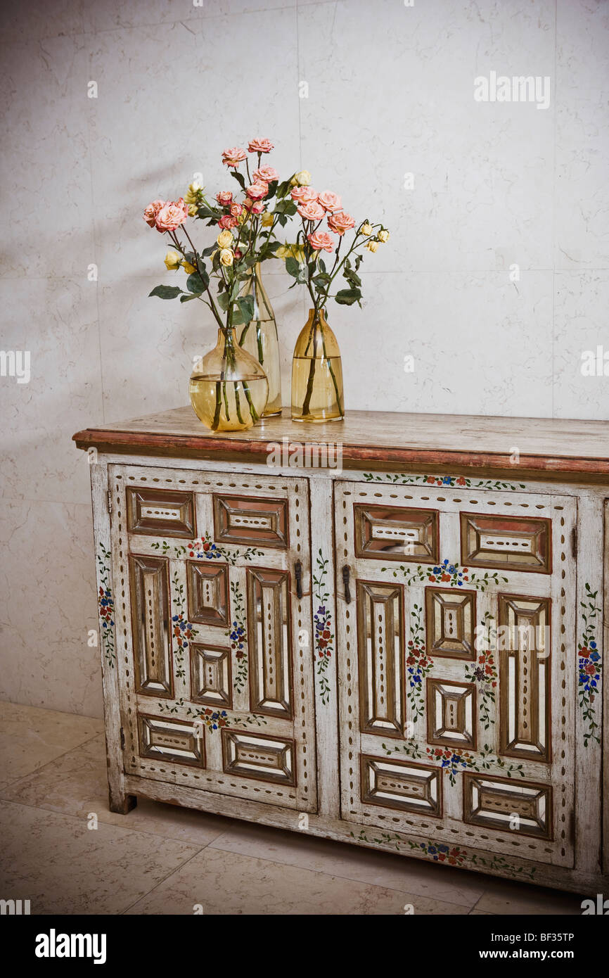 Flower vases on a sideboard Stock Photo - Alamy