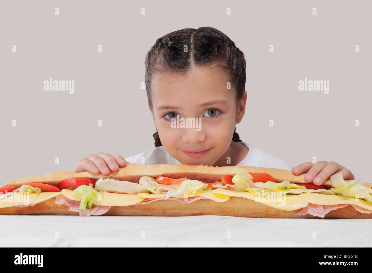 Portrait of a girl with a submarine sandwich Stock Photo - Alamy
