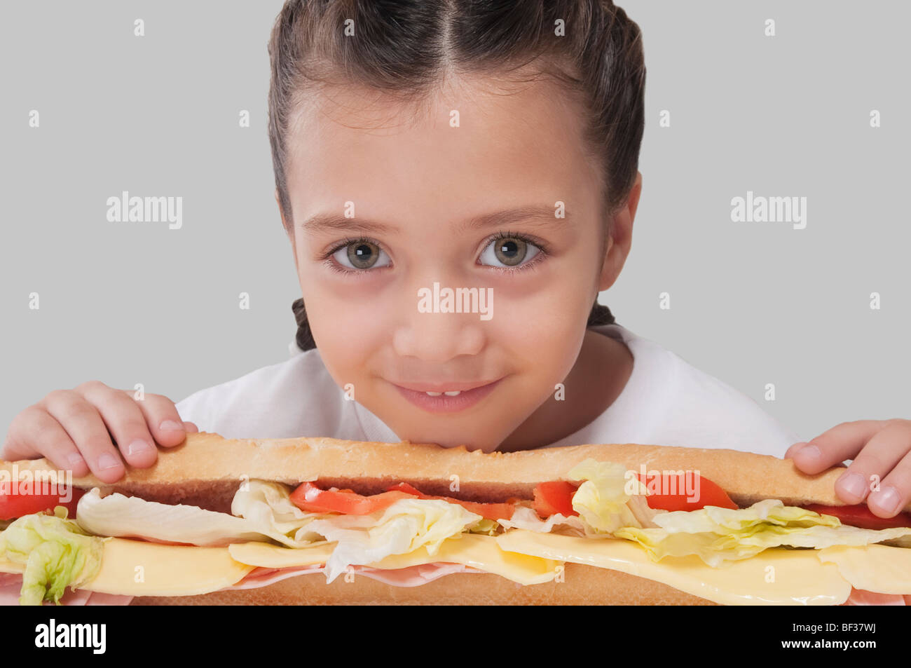 Portrait of a girl with a submarine sandwich Stock Photo - Alamy