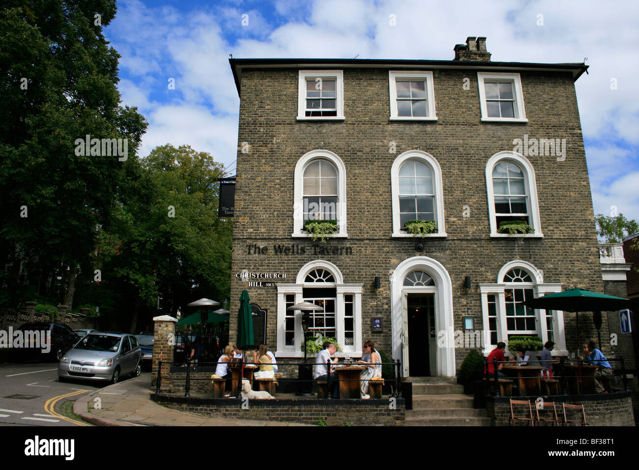 People enjoying a drink at The Wells Tavern pub in Hampstead, London ...