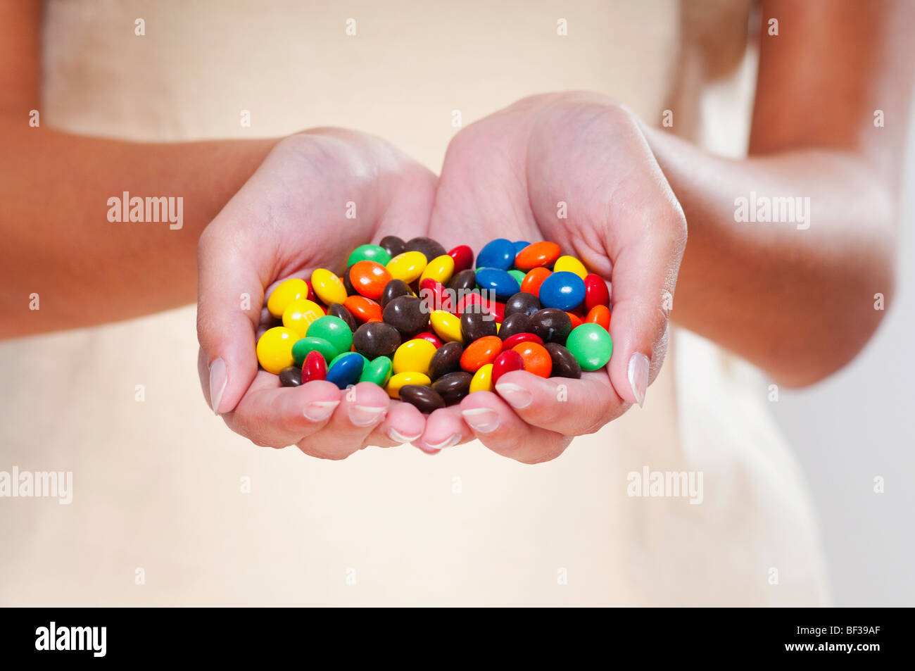 Handful of candy Stock Photo - Alamy