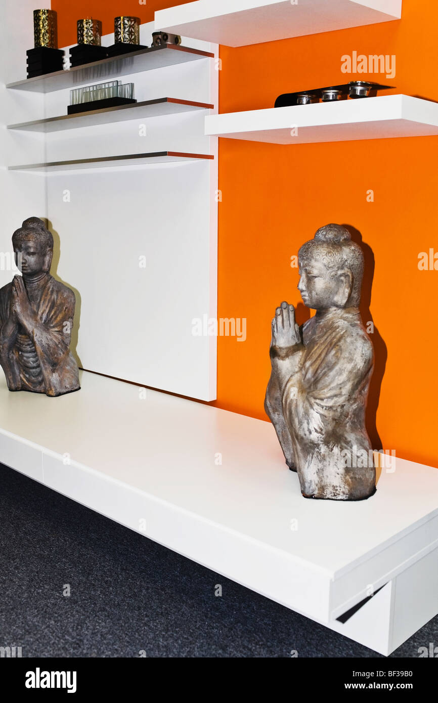 Statues of Buddha on a table Stock Photo - Alamy