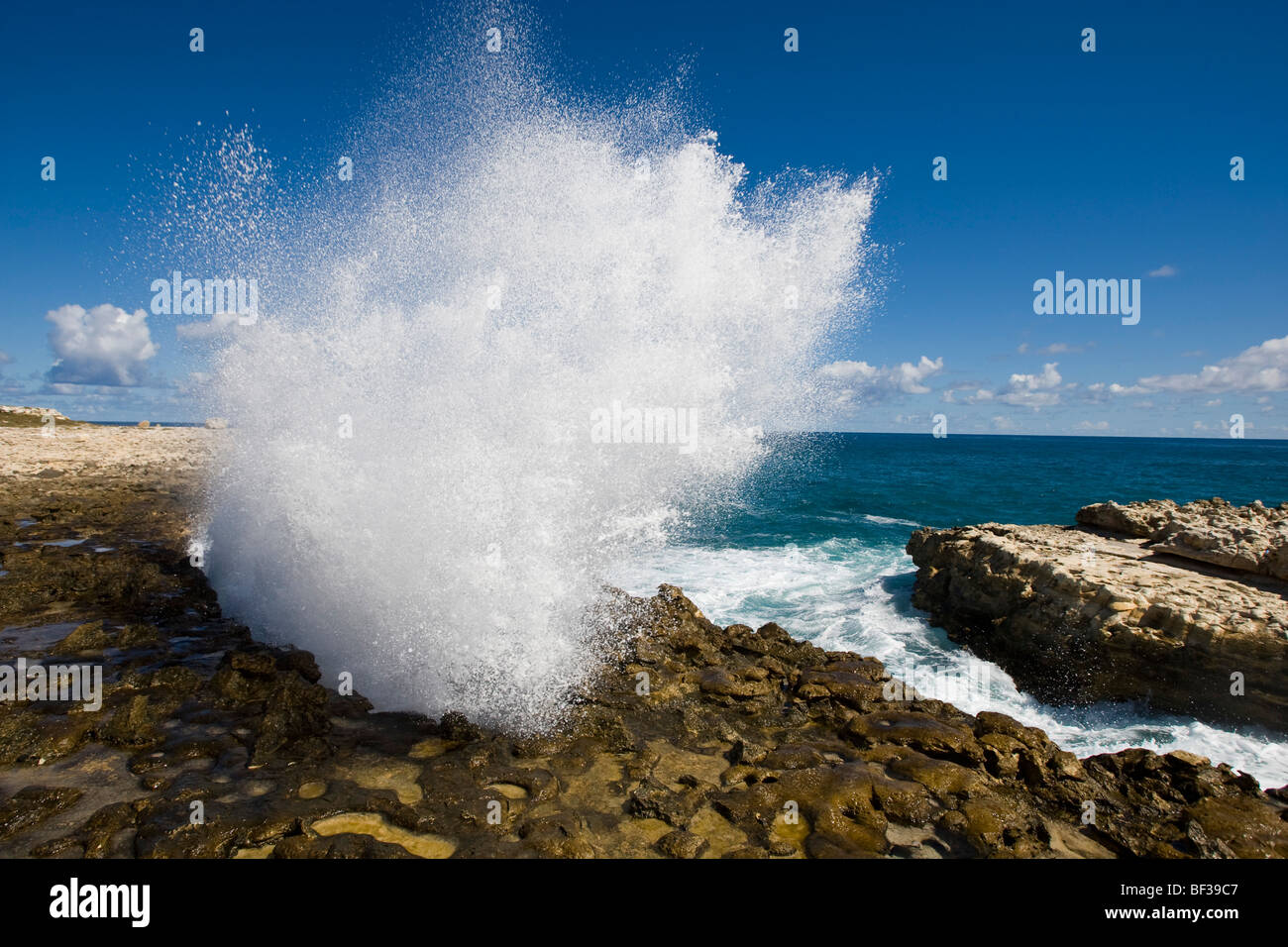 Water bursting through hole in rock hi-res stock photography and images ...