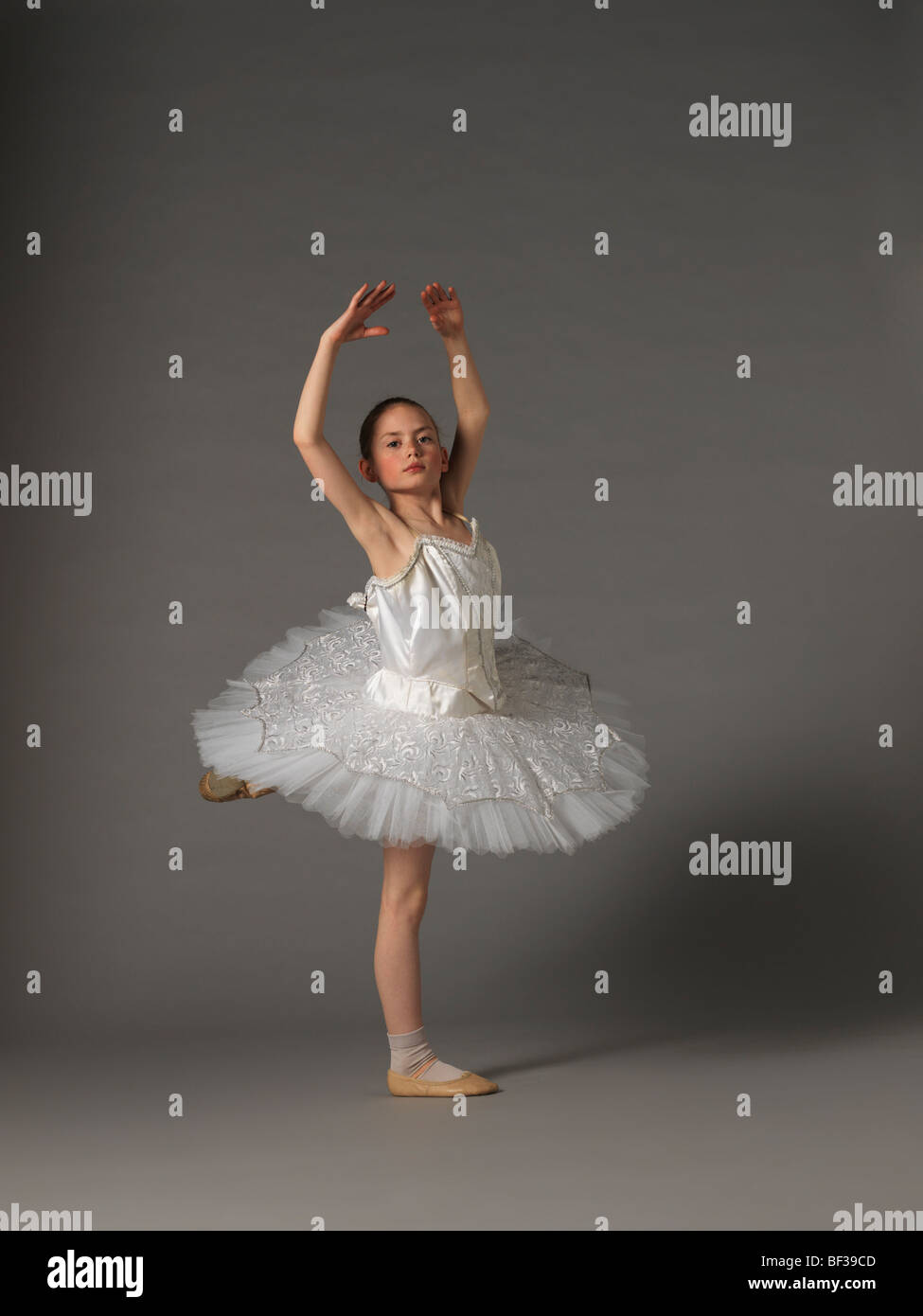 Girl in white tutu posing Stock Photo - Alamy