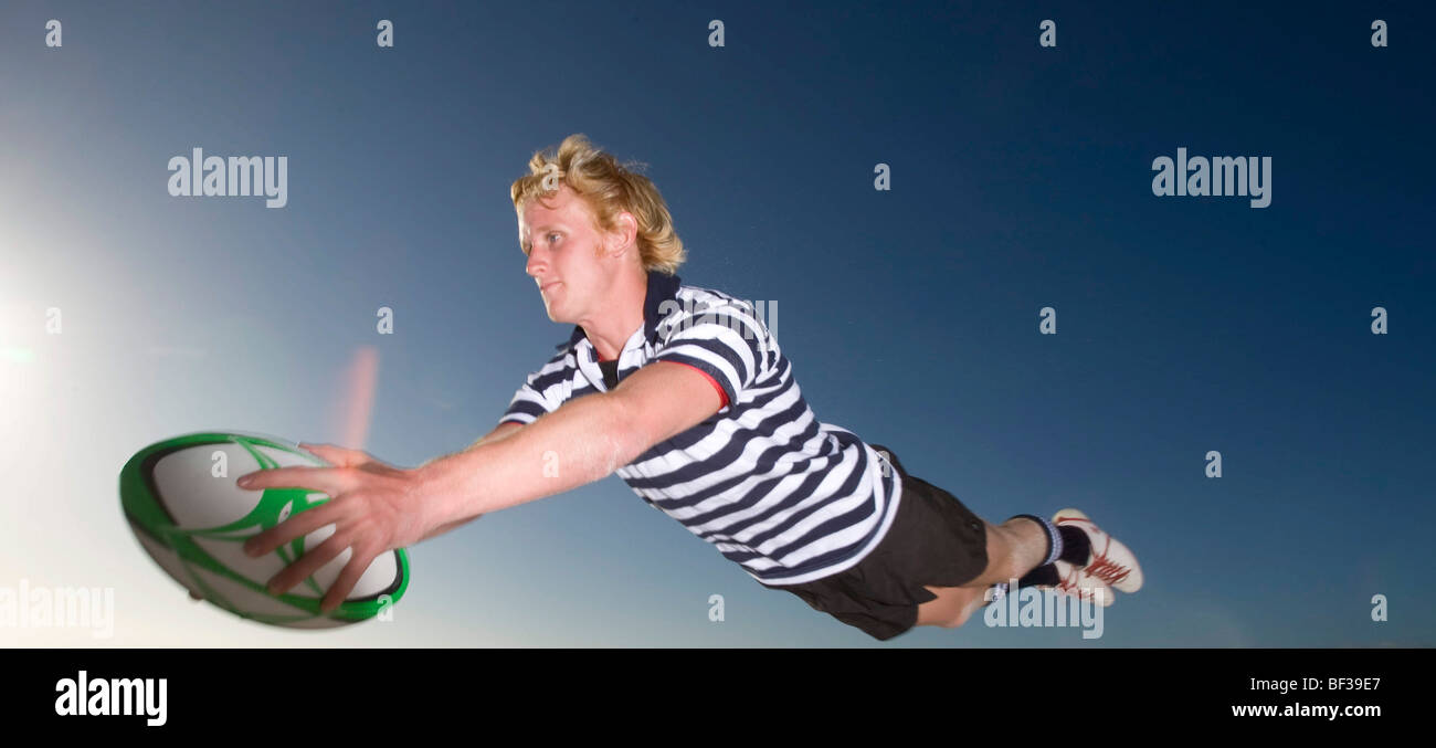 Rugby Player scoring a try Stock Photo - Alamy